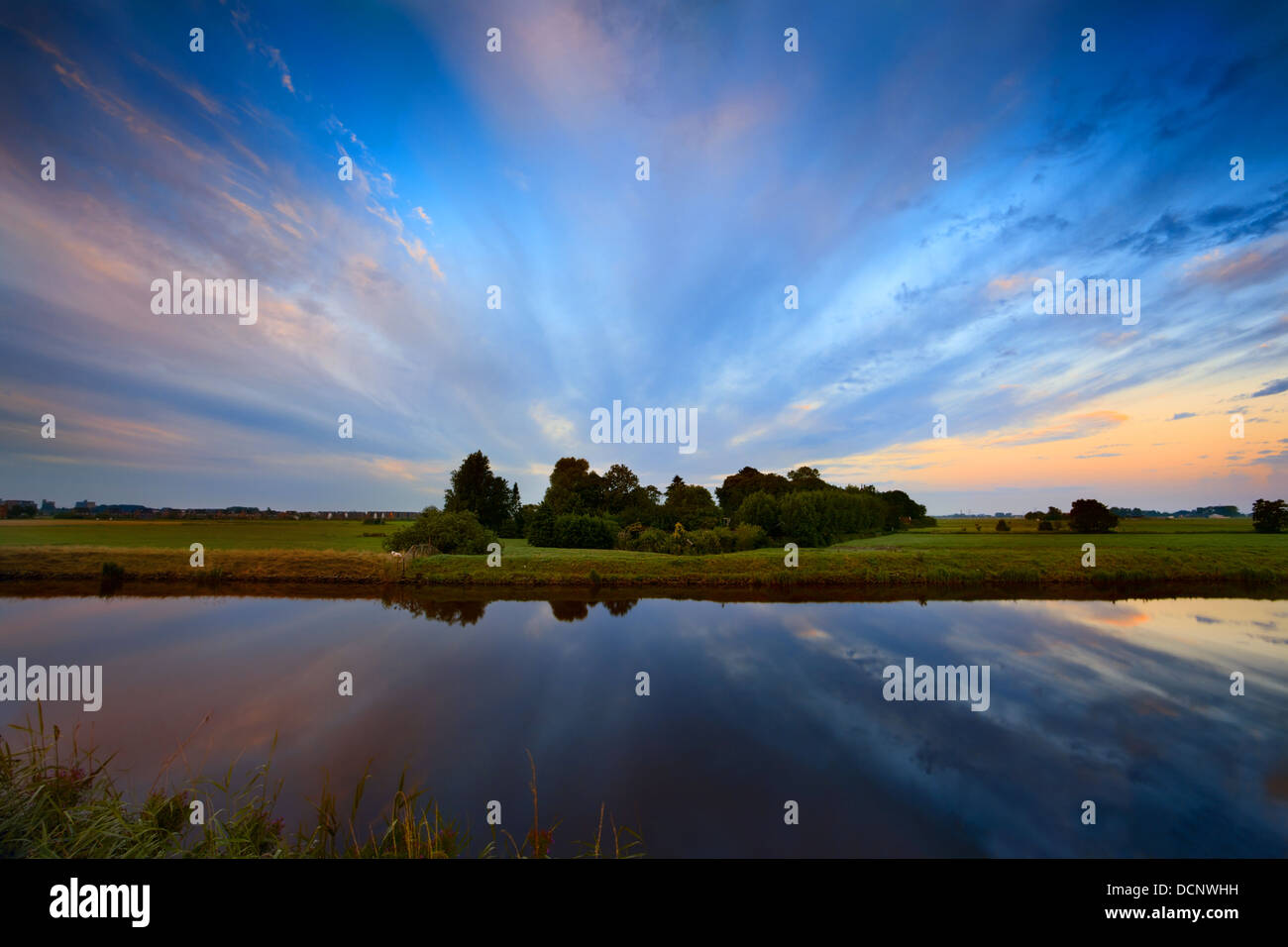 symmetrical reflection of sky in water Stock Photo - Alamy