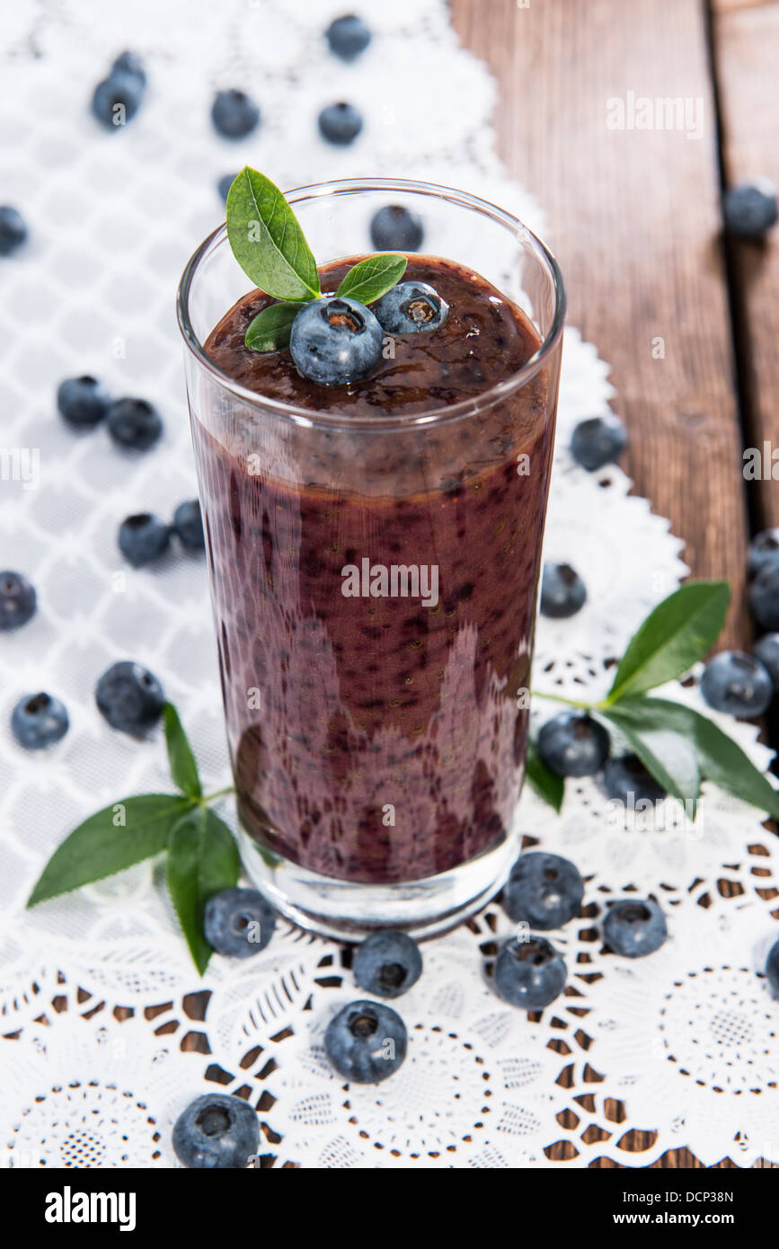 Healthy Blueberry Shake on wooden background Stock Photo - Alamy
