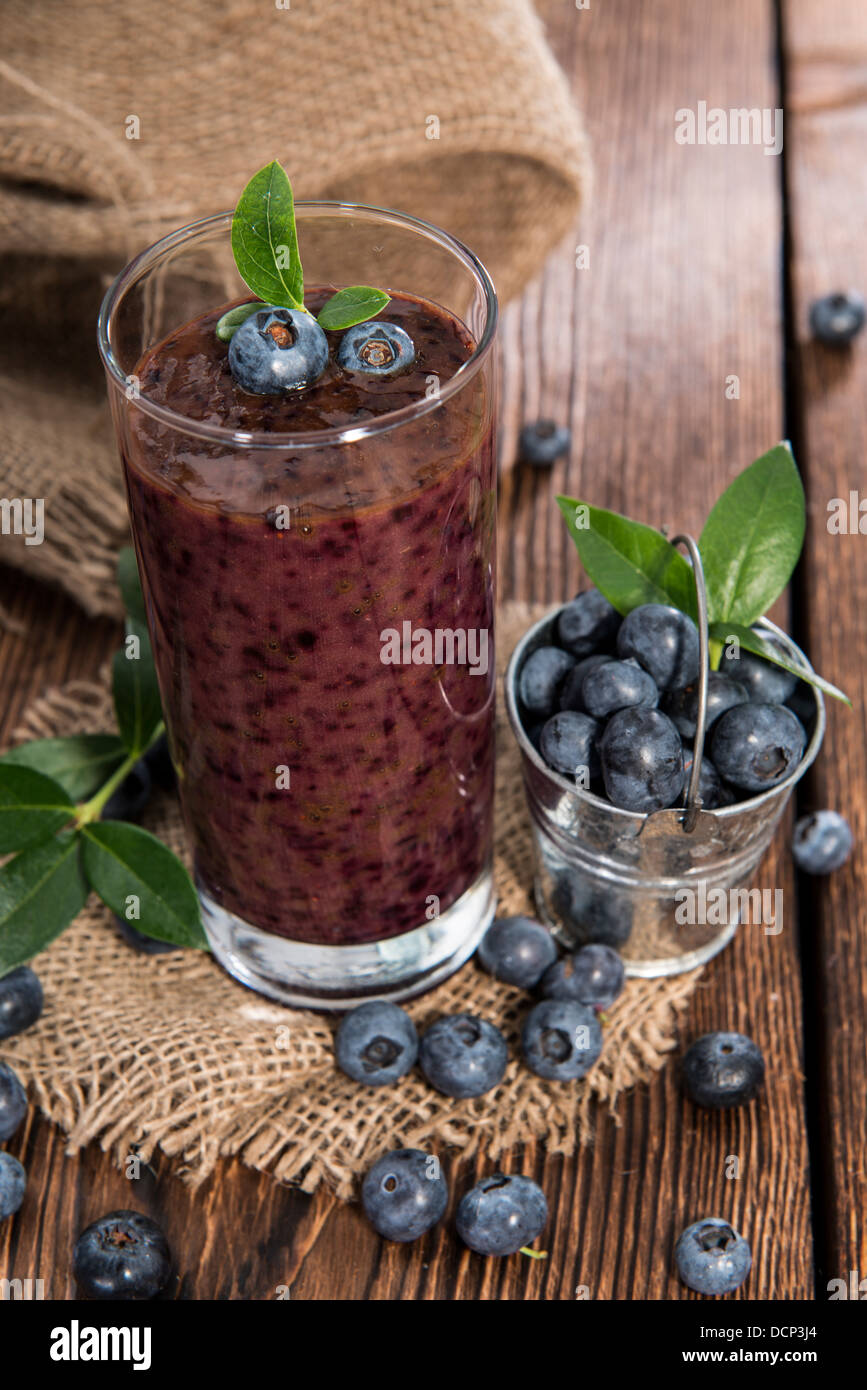 Healthy Blueberry Shake on wooden background Stock Photo - Alamy