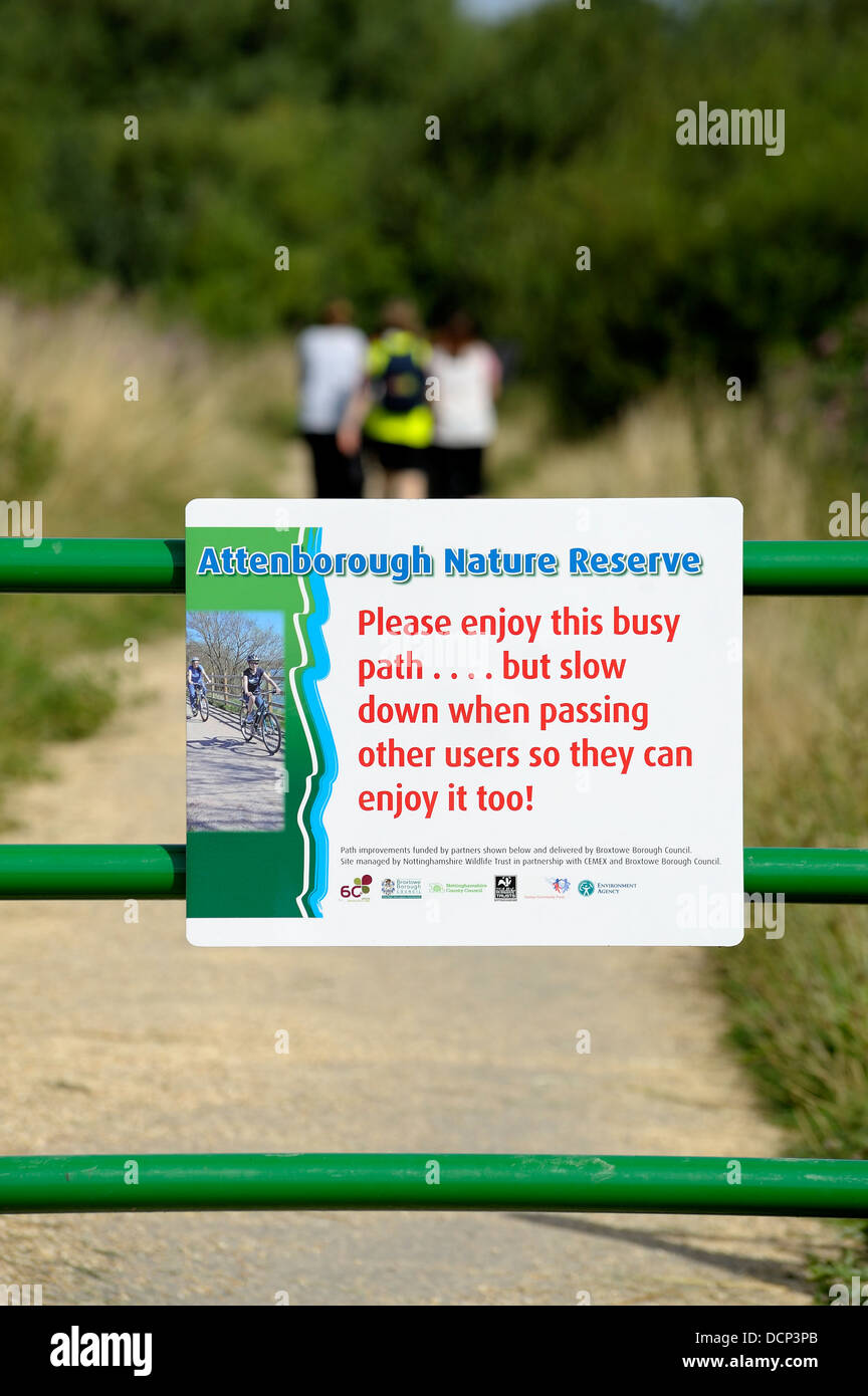 sign advising cyclists to slow down and allow other users to enjoy the ...