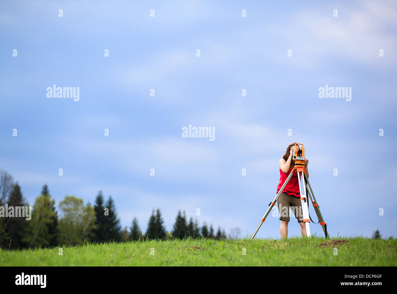 Young land surveyor at work Stock Photo - Alamy