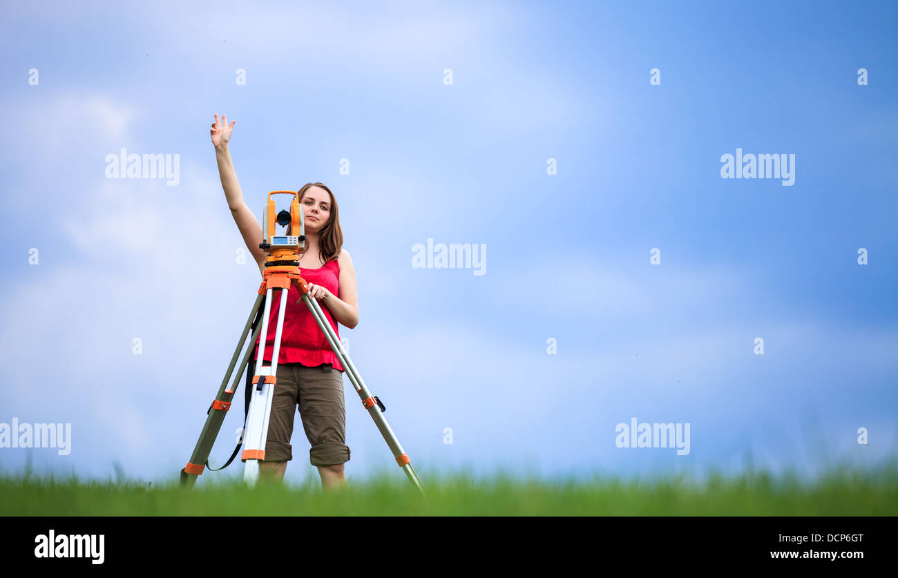 Young land surveyor at work Stock Photo - Alamy
