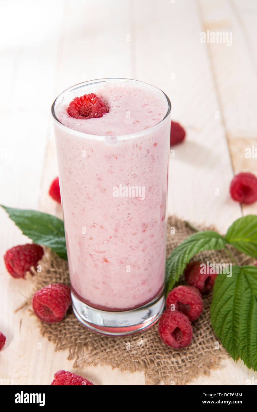 Fresh made Raspberry Milkshake on wooden background Stock Photo - Alamy