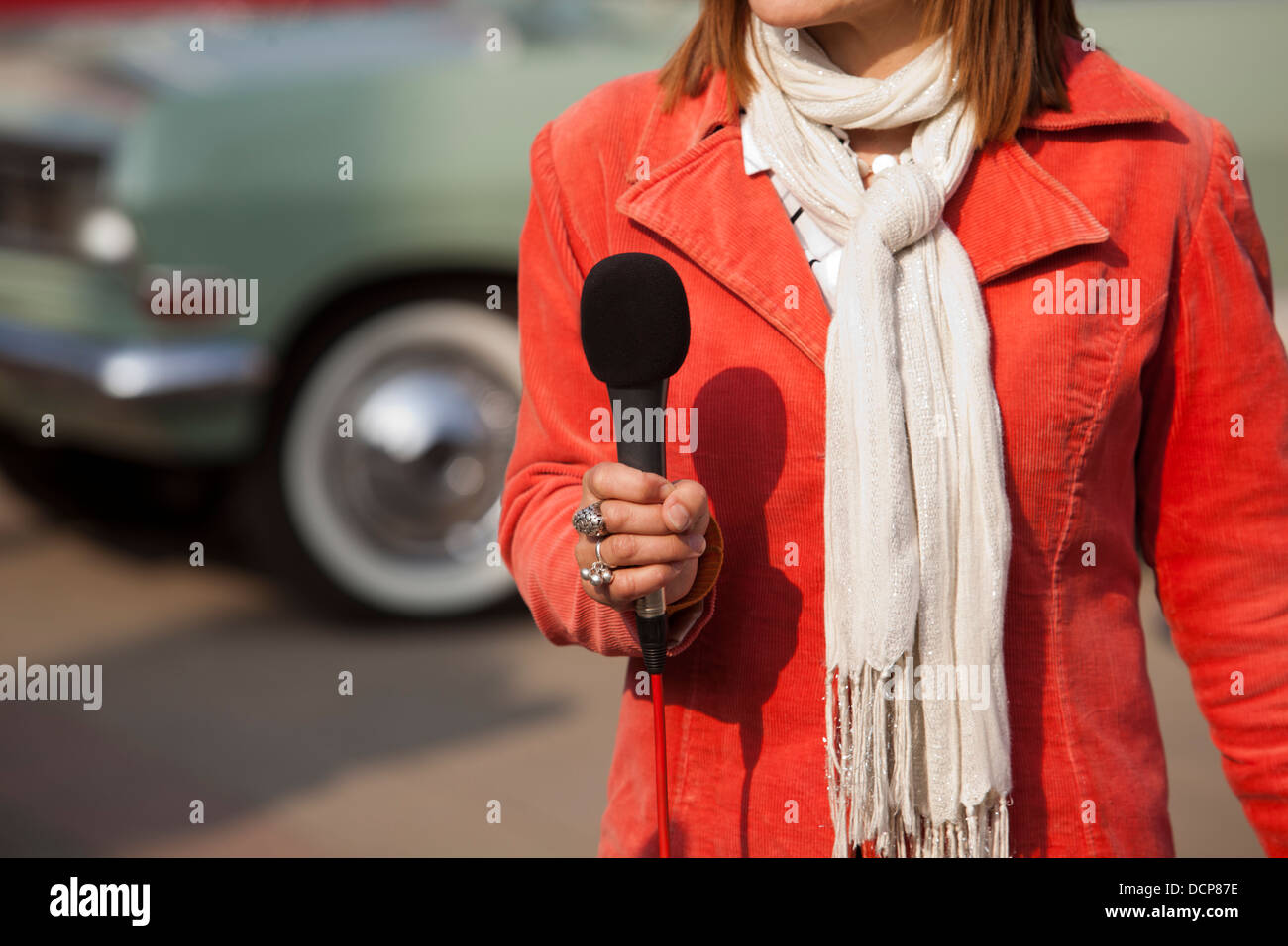 A journalist is making a interview with a microphone Stock Photo - Alamy