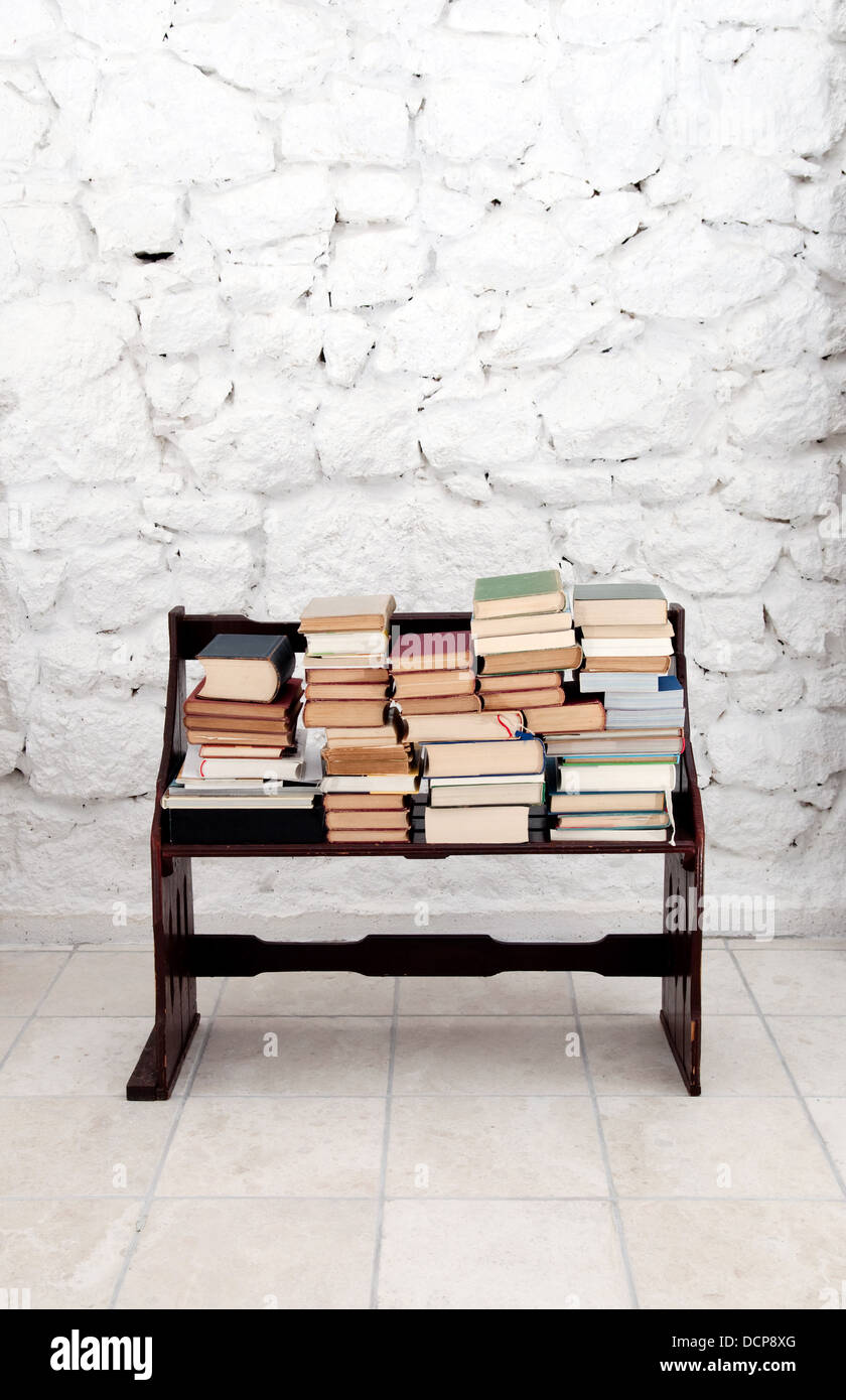 Books on old wooden bench Stock Photo - Alamy
