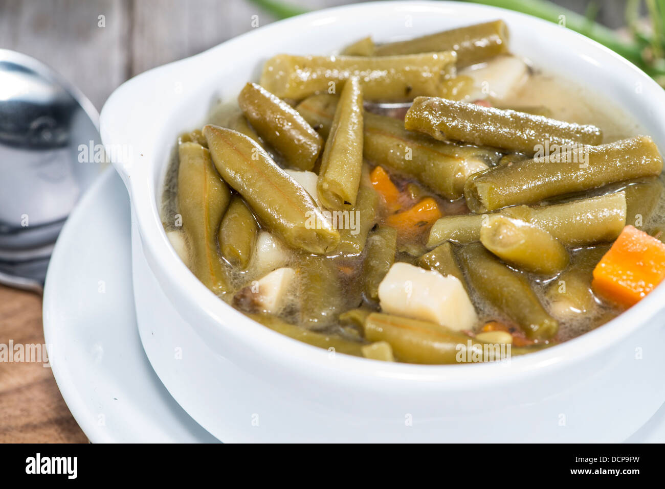 Homemade Green Bean Stew on vintage wooden background Stock Photo - Alamy