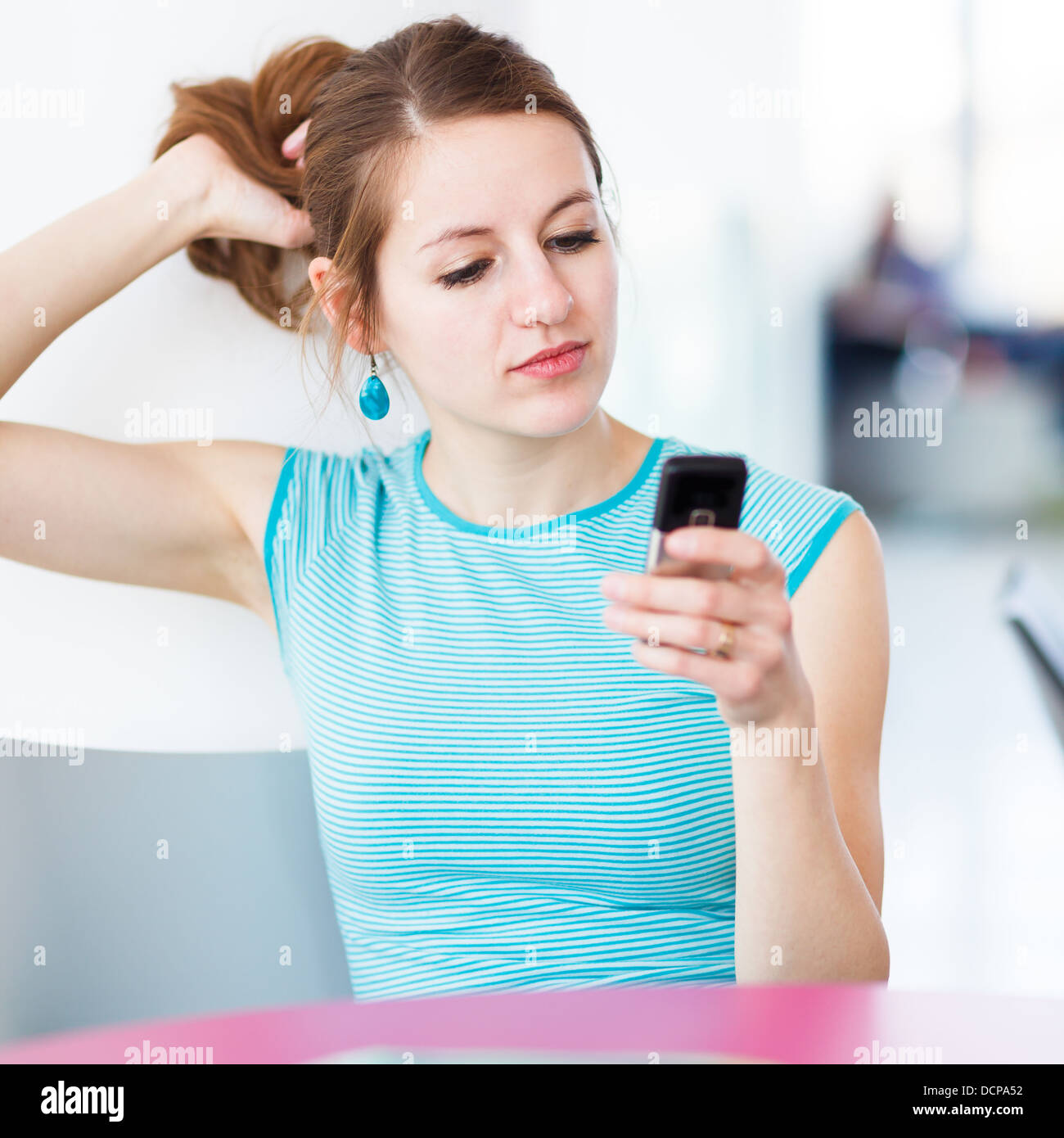 Pretty young woman using her mobile phone/speaking on the phone Stock ...