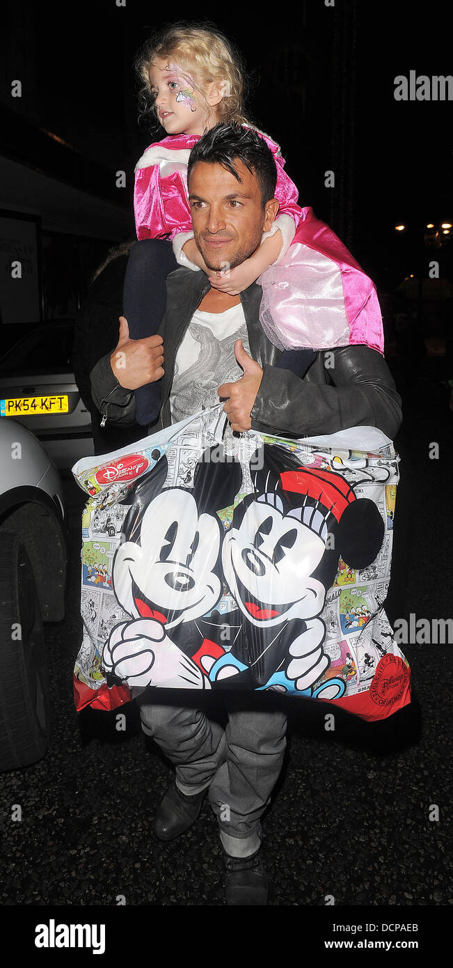 Peter Andre leaving the Disney store on Oxford Street, carrying his ...