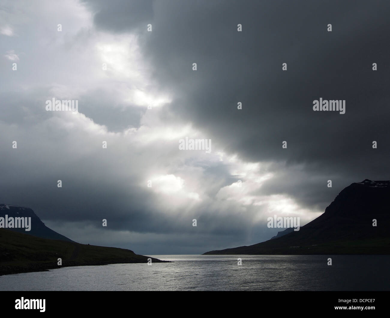 Rain clouds over an icelandic fjord hi-res stock photography and images ...
