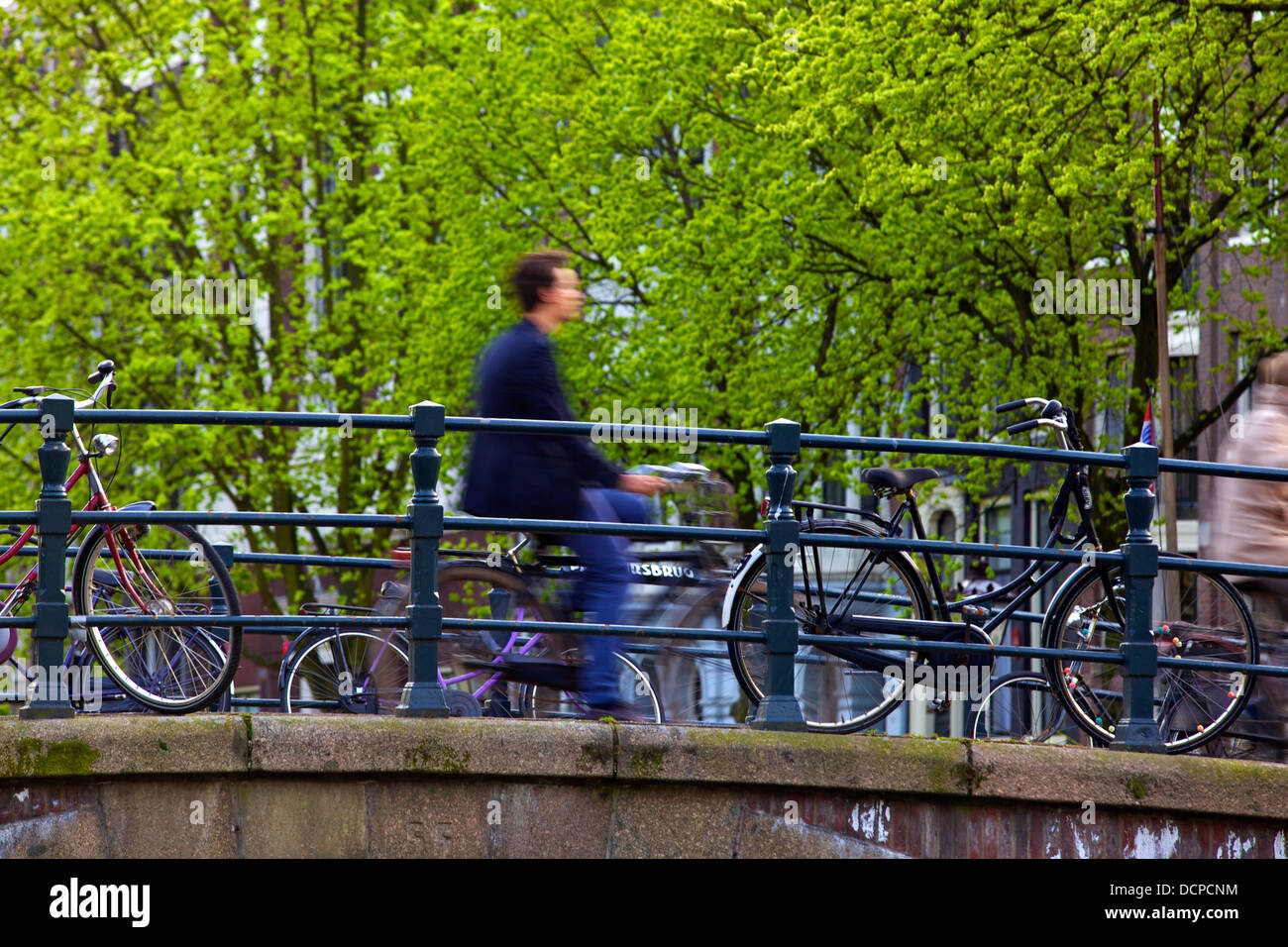 Cyclist Crossing Bridge, Amsterdam, Netherlands, Europe Stock Photo - Alamy