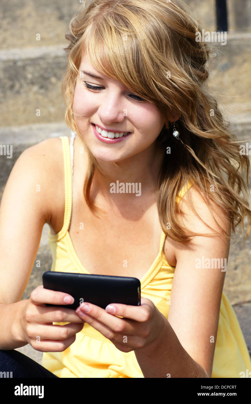 Teenager texting on mobile or cell phone Stock Photo - Alamy