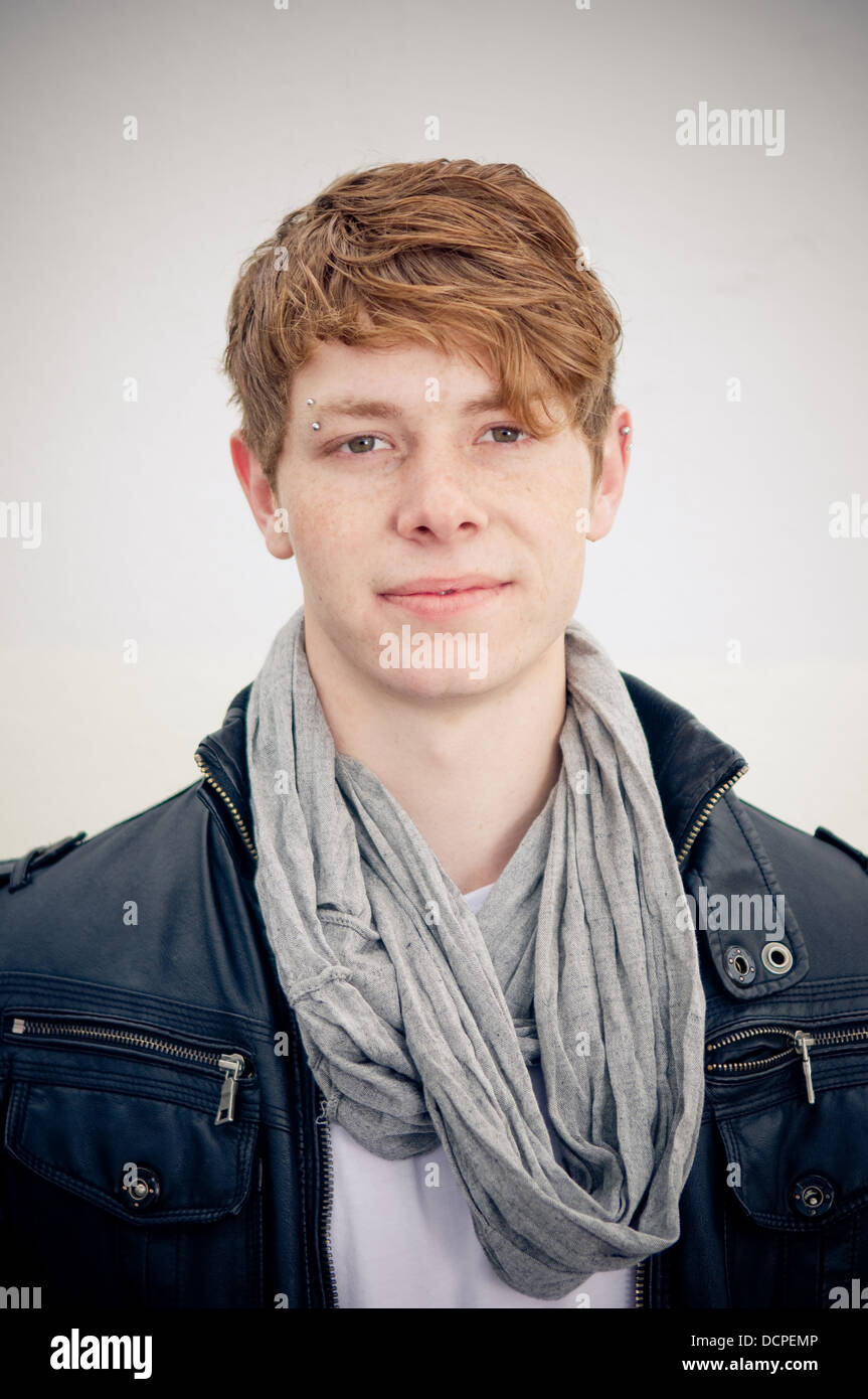 Portrait of real young man on simple background Stock Photo - Alamy