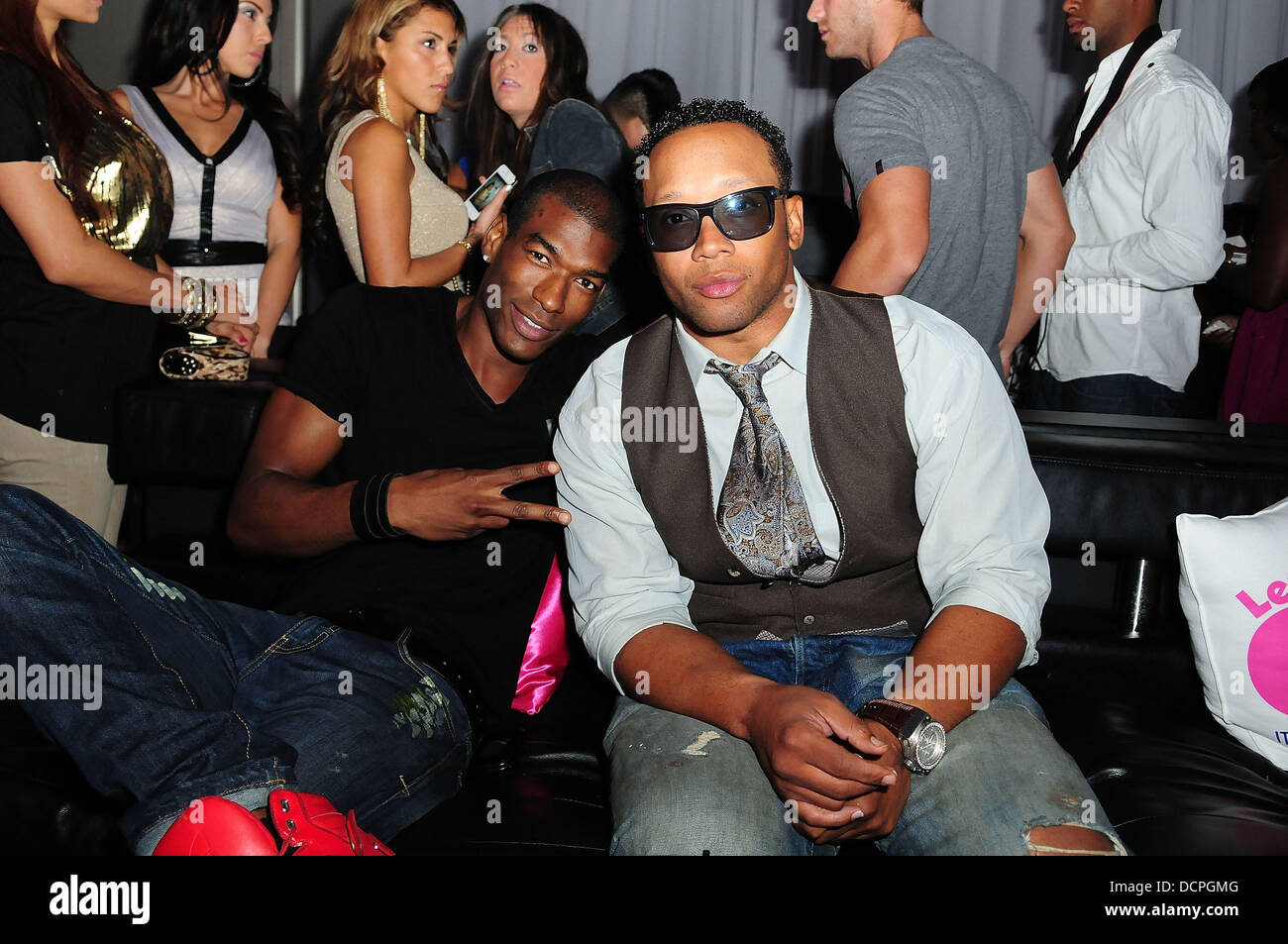 Model Bobby Roache and former NFL player Jamal Anderson at "Lets Get ...