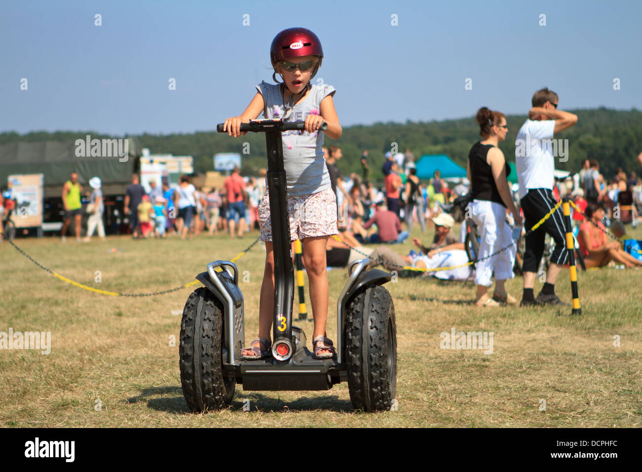 Little girl ride on segway during air show picnic Katowice, Poland ...