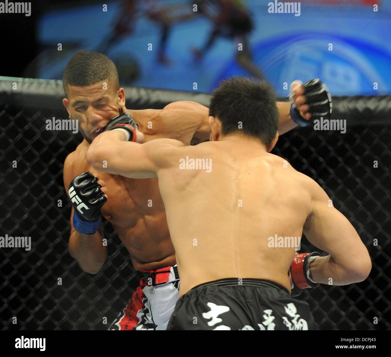 Pictured landing a punch is Michihiro Omigawa of Japan who won a points ...