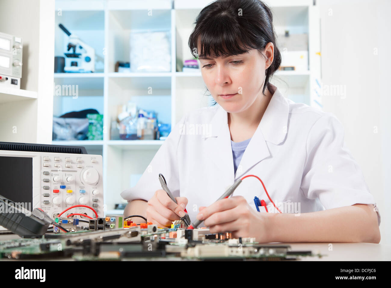 Girl debugging an electronic precision device Stock Photo - Alamy