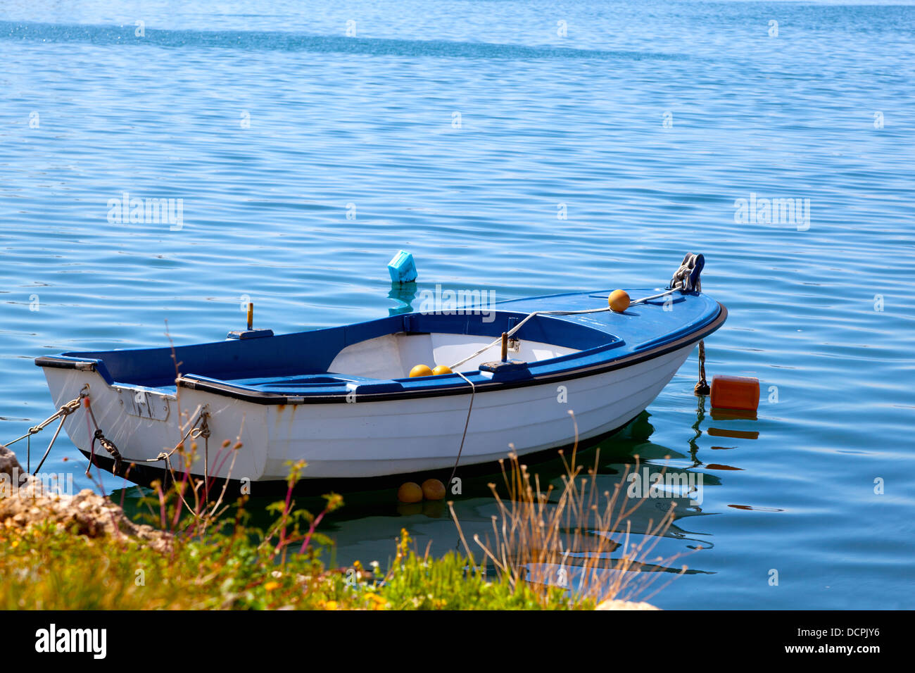 One fishing boat floating on the water Stock Photo - Alamy