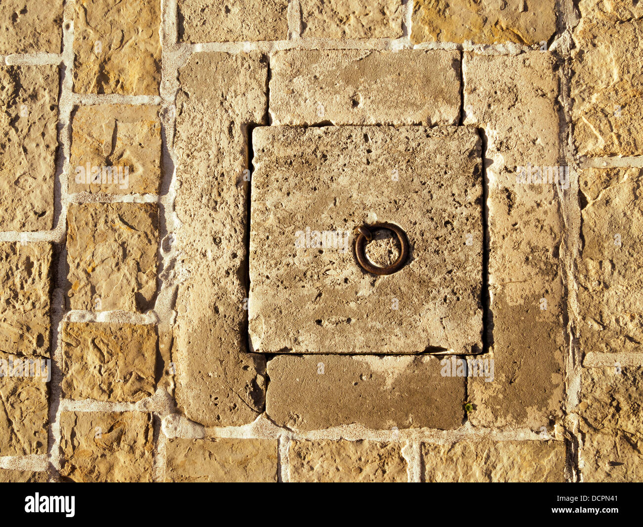 square hatch with metallic ring handle in ancient pavement Stock Photo ...