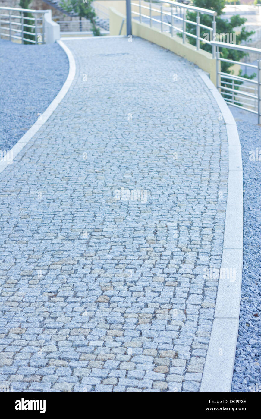 Cobblestone path made with marble in a garden Stock Photo - Alamy