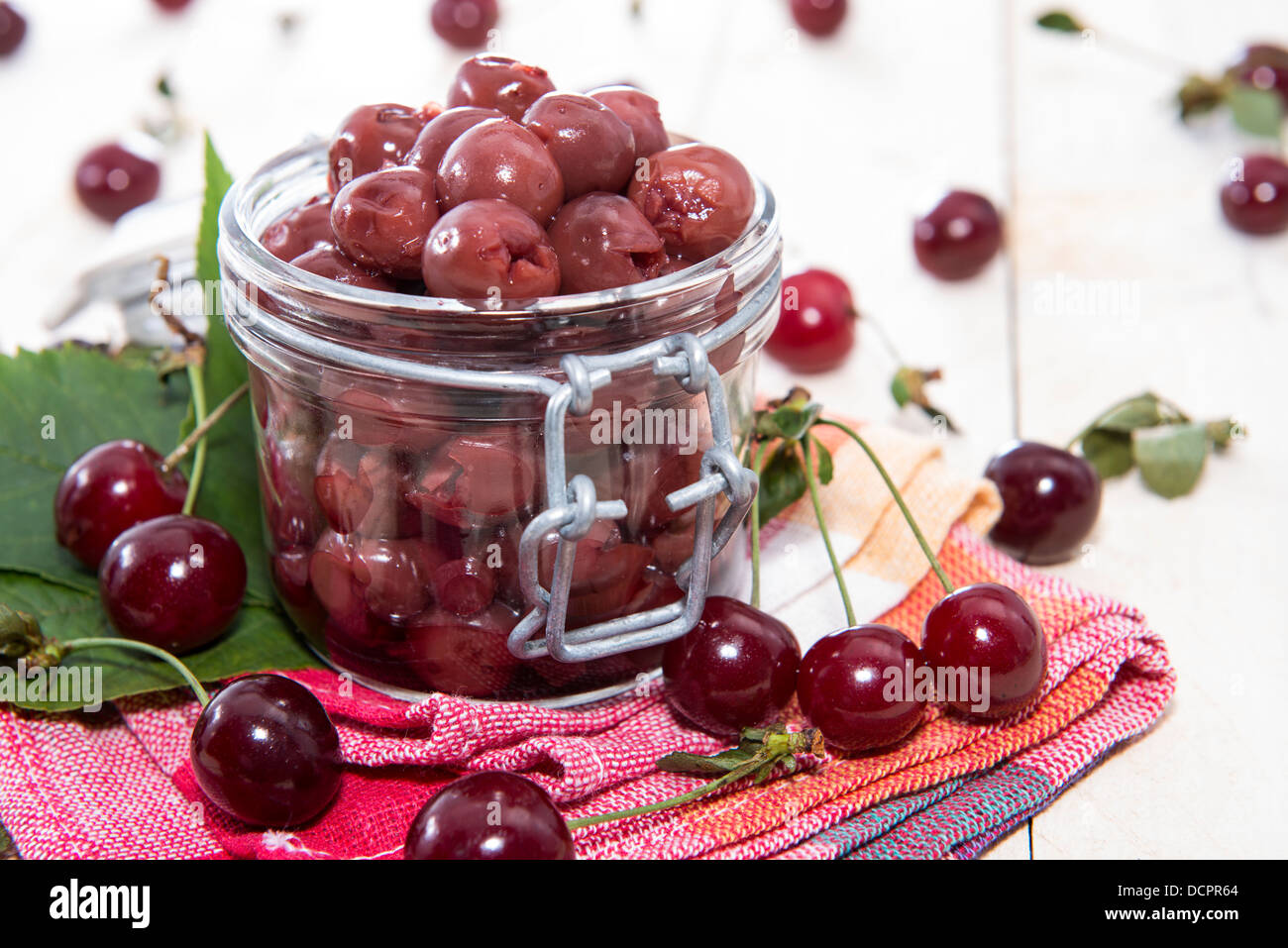 Preserved Cherries on wooden background Stock Photo - Alamy