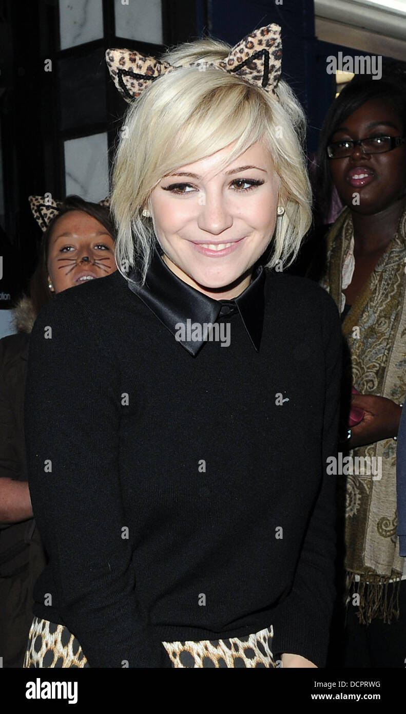 Pixie Lott leaves Capital Radio wearing leopard patterned cat ears ...