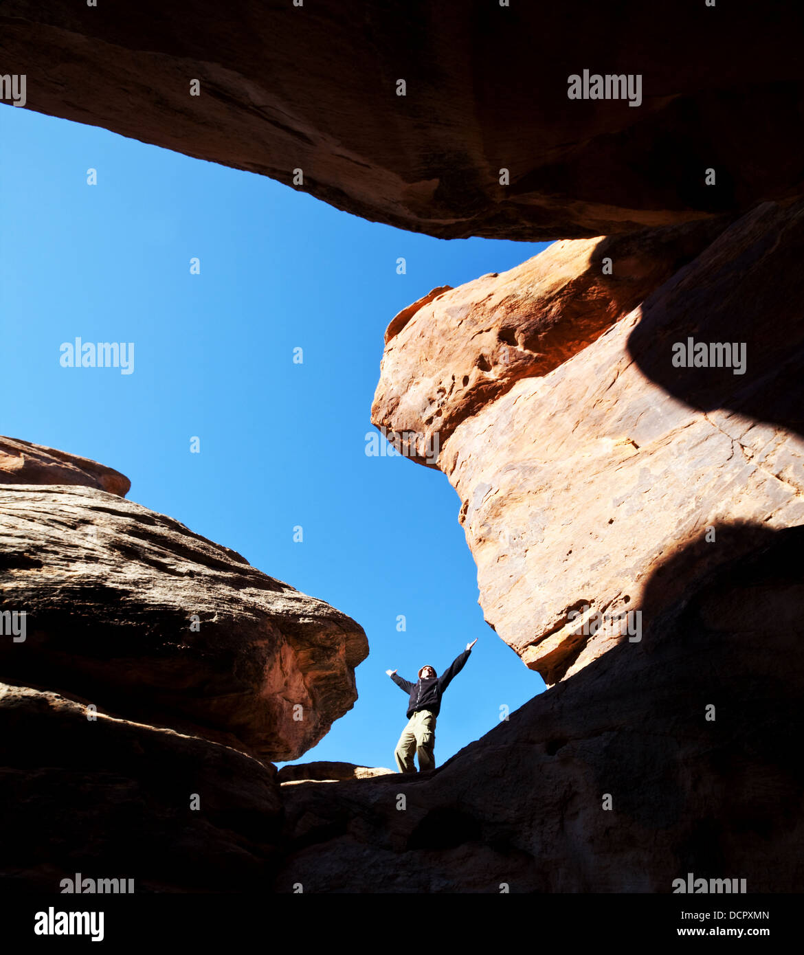 Man on the cliff Stock Photo - Alamy