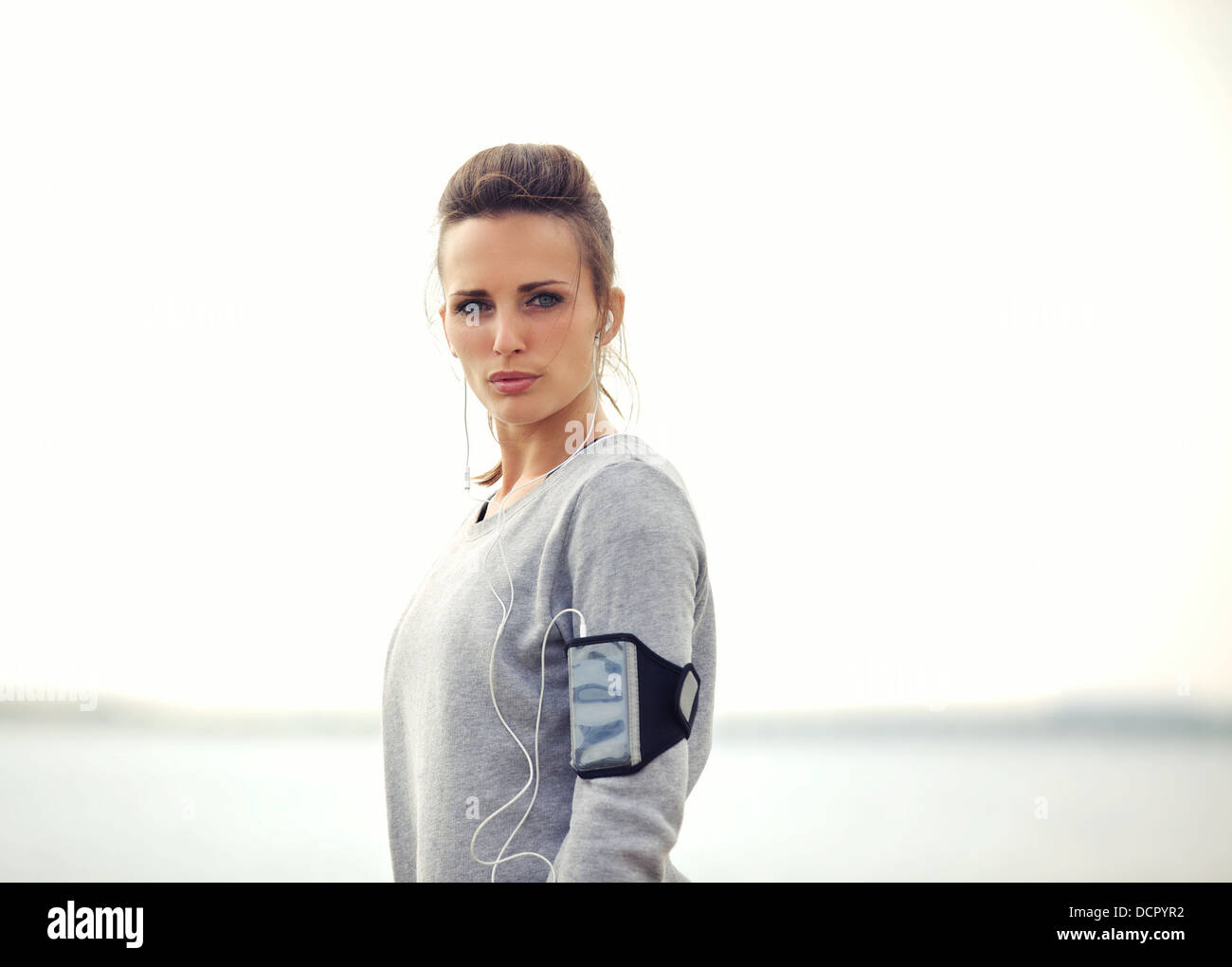 Closeup of a female runner serious about running Stock Photo - Alamy
