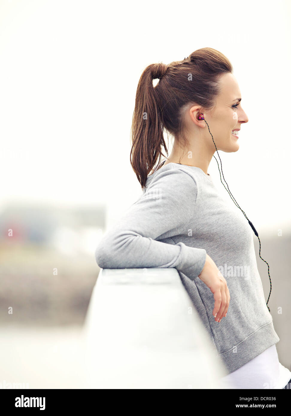 Portrait of a female relaxing after running Stock Photo - Alamy