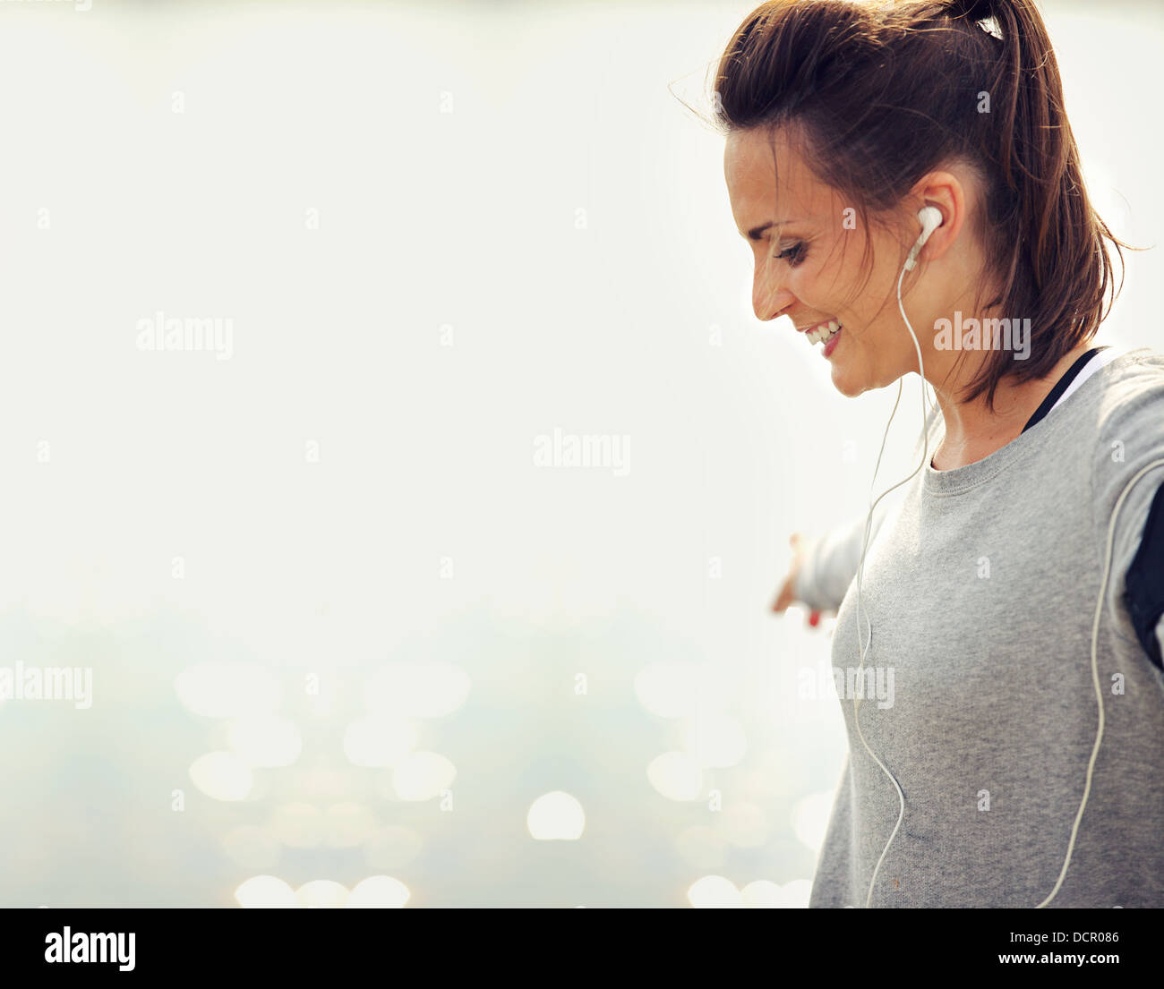 Closeup of a female runner smiling Stock Photo - Alamy
