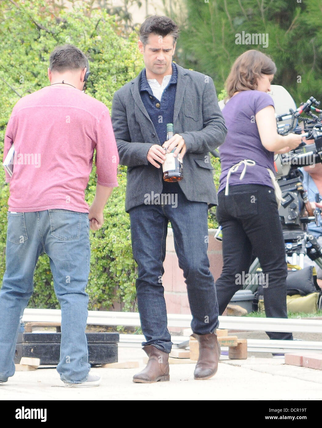 Irish actor, Colin Farrell looks inebriated as he drinks from a bottle ...