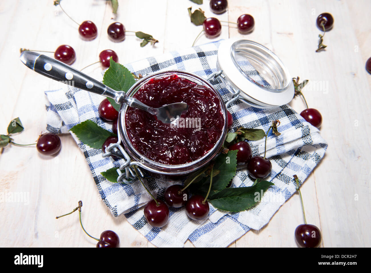 Portion of homemade Cherry Jam with fresh fruits Stock Photo - Alamy