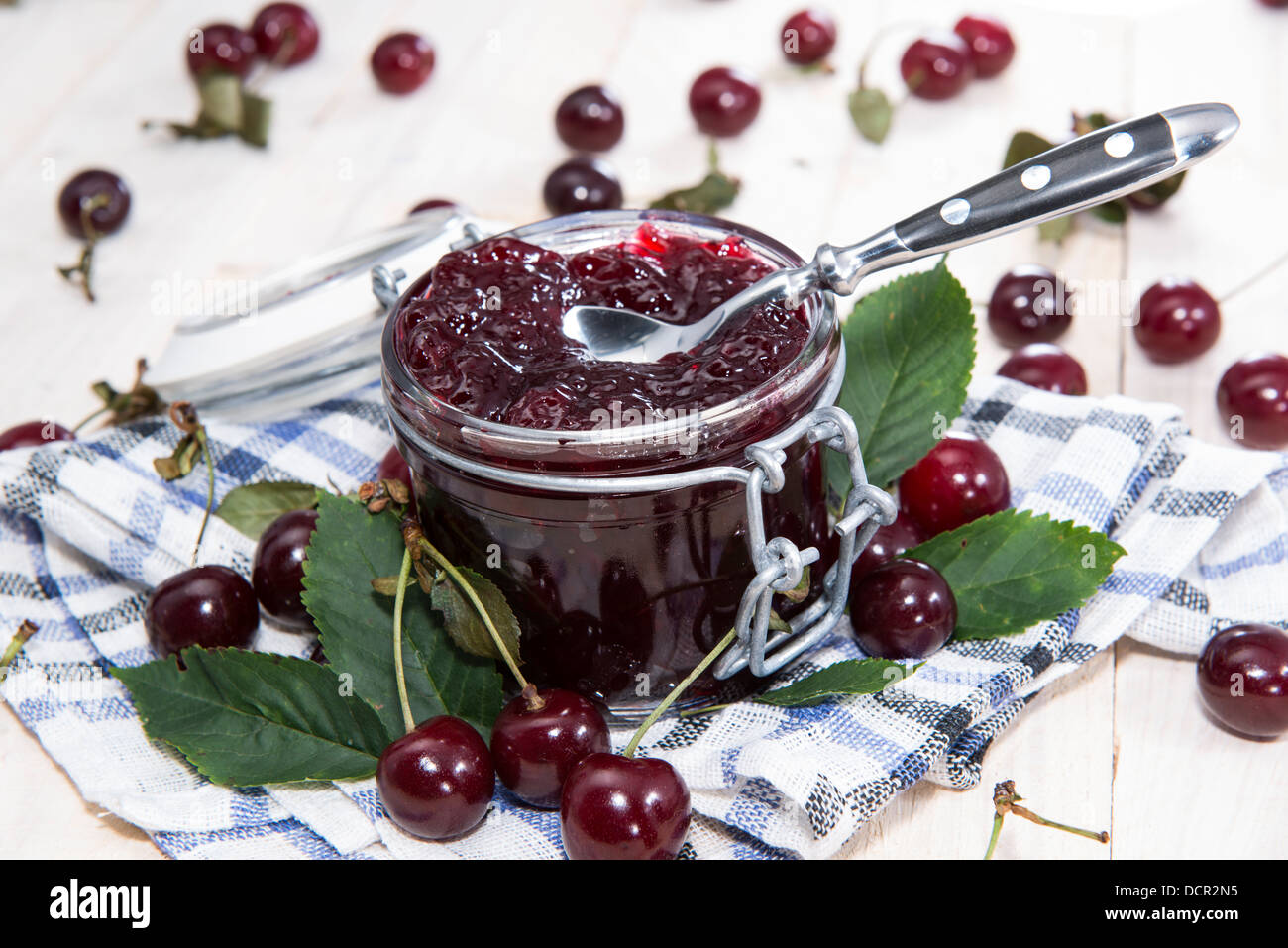Portion of homemade Cherry Jam with fresh fruits Stock Photo - Alamy