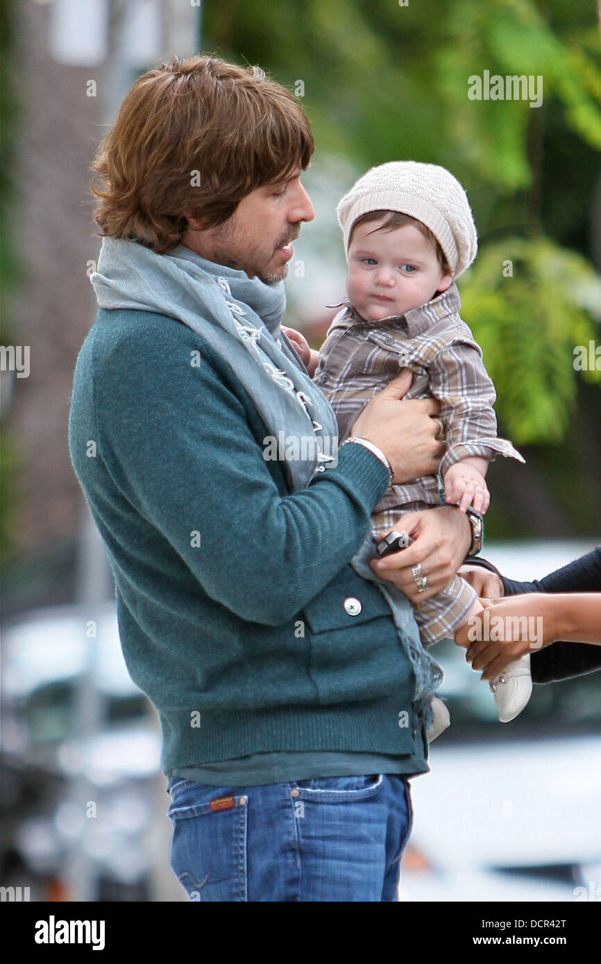 Rodger Berman holds his son Skyler as he arrives at Le Pain Quotidien ...