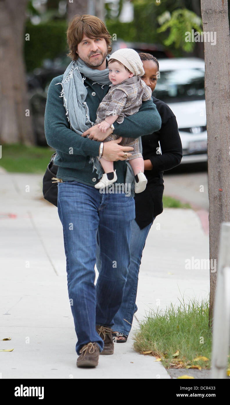 Rodger Berman holds his son Skyler as he arrives at Le Pain Quotidien ...