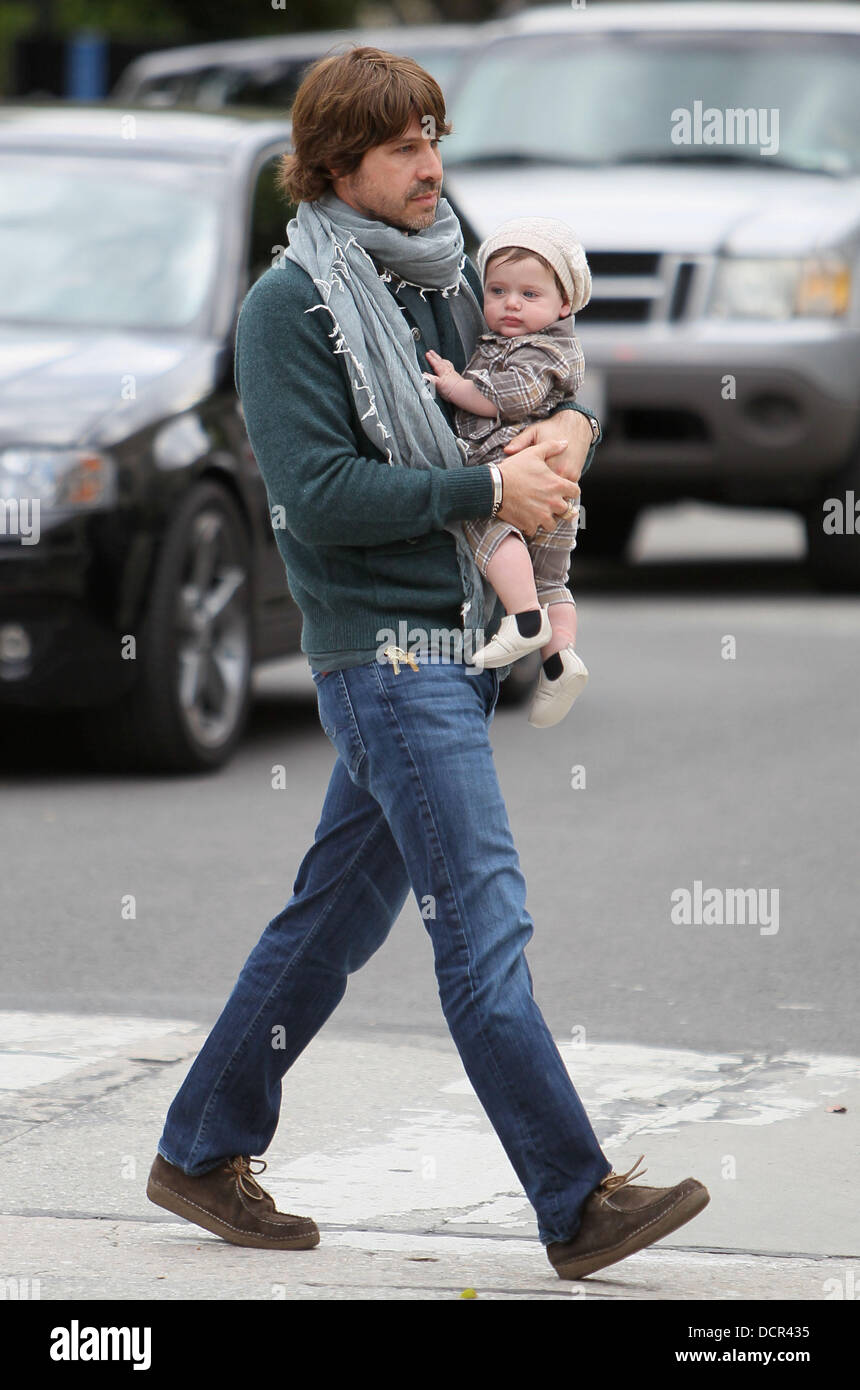 Rodger Berman holds his son Skyler as he arrives at Le Pain Quotidien ...