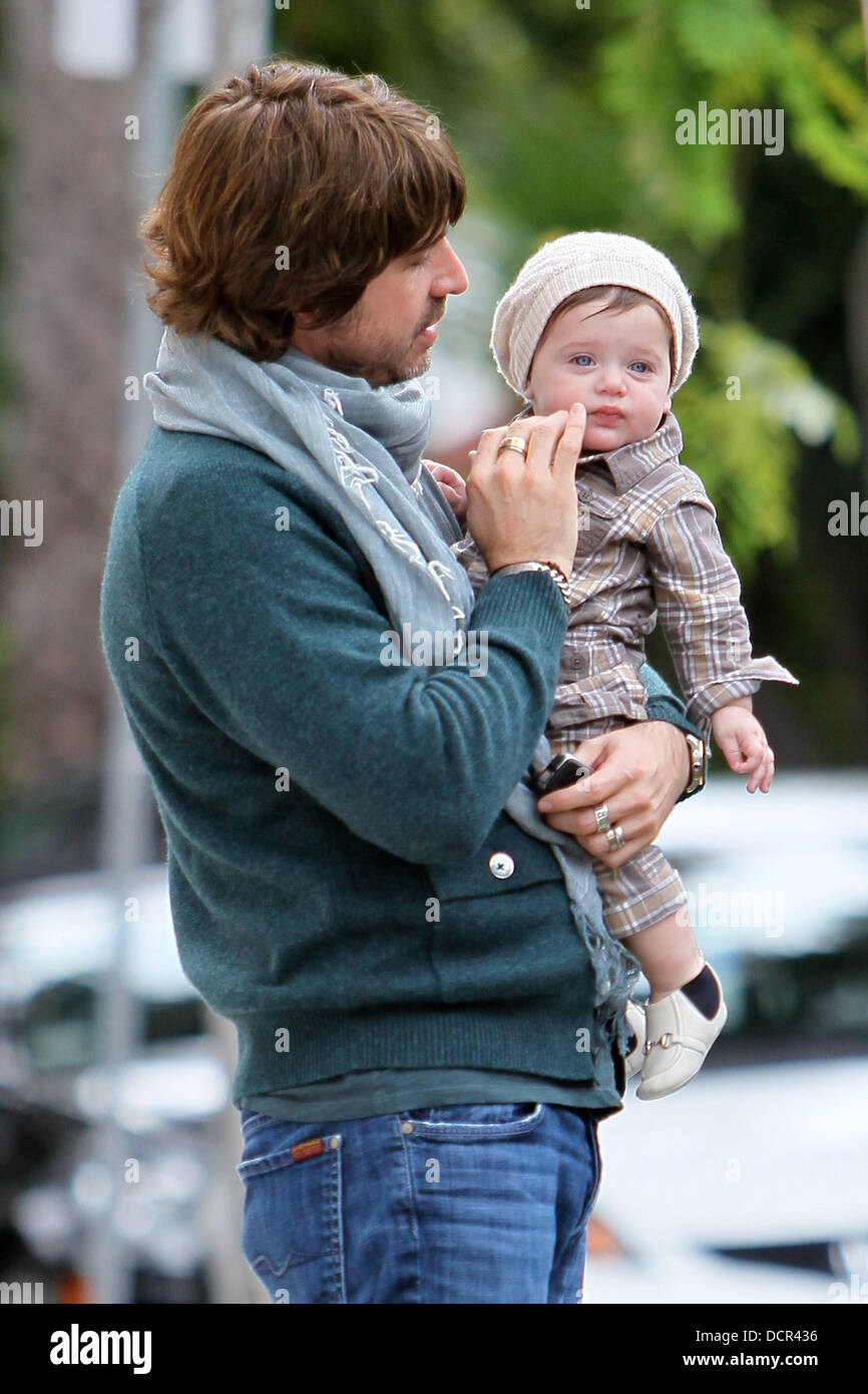 Rodger Berman holds his son Skyler as he arrives at Le Pain Quotidien ...