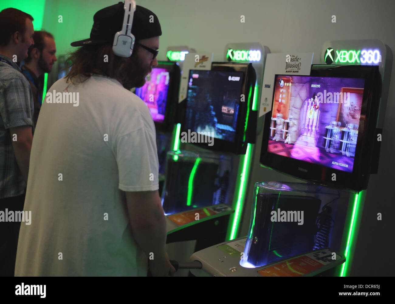 Cologne, Germany. 21st Aug, 2013. A person tests the new Xbox 360 at a ...