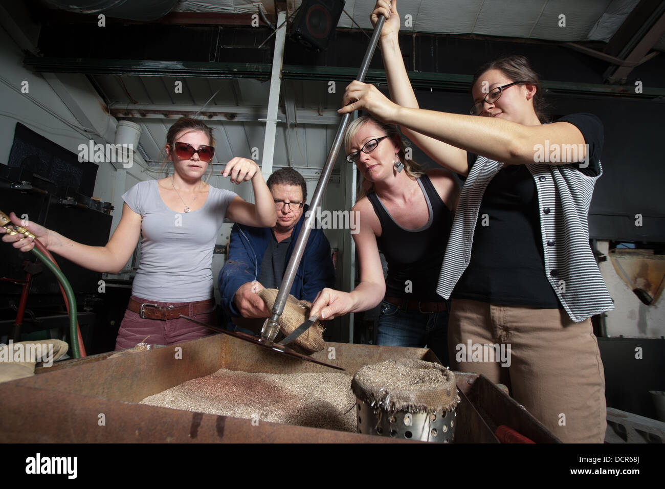 Four workers busy hi-res stock photography and images - Alamy