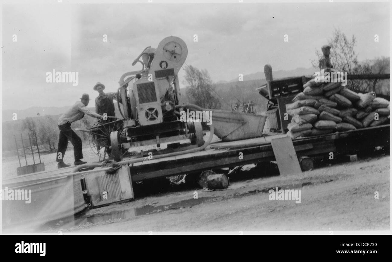 Pumps and sandbags are utilized in road construction to manage water ...