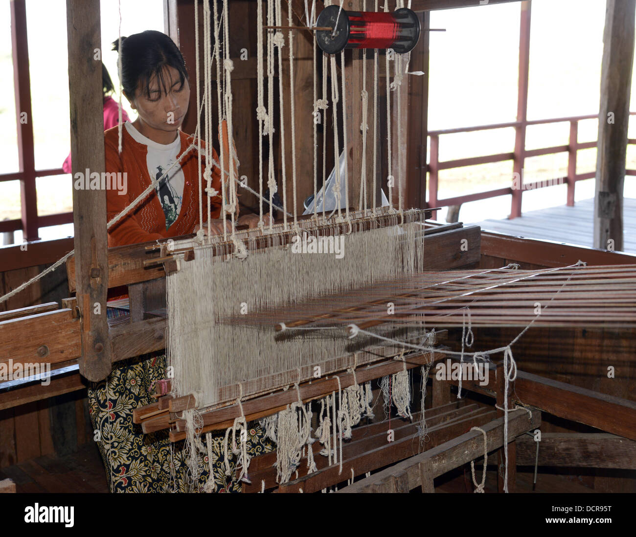 A woman works at a hand loom in a silk weaving mill Stock Photo - Alamy