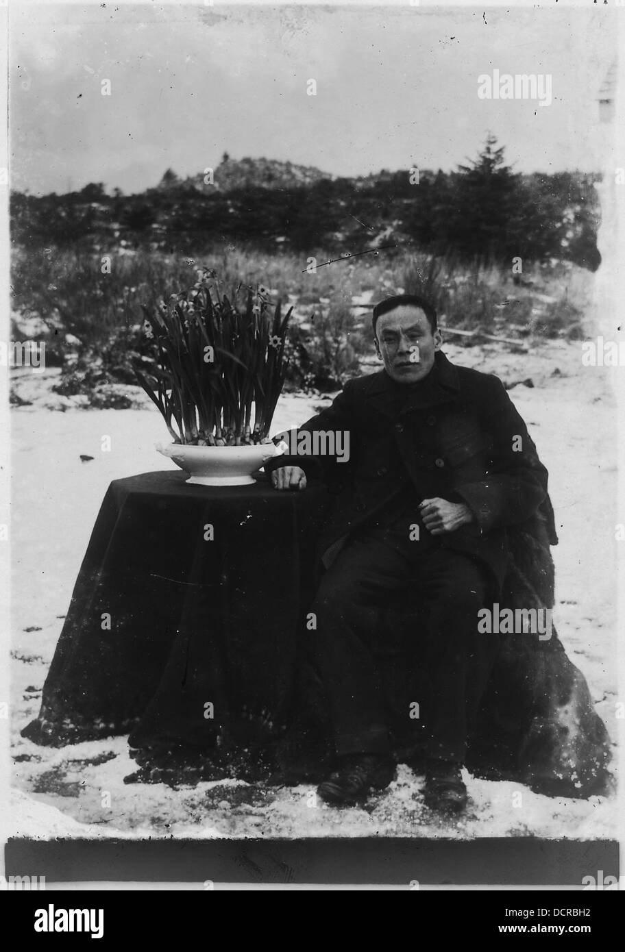 Yow, a Chinese cook, is shown in this image serving Bishop Ridley at ...