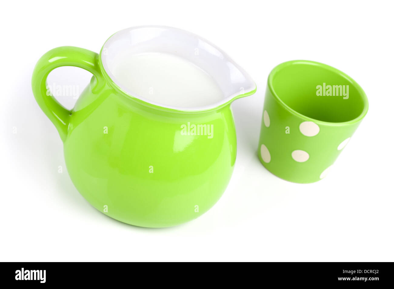 green jug with milk Stock Photo - Alamy