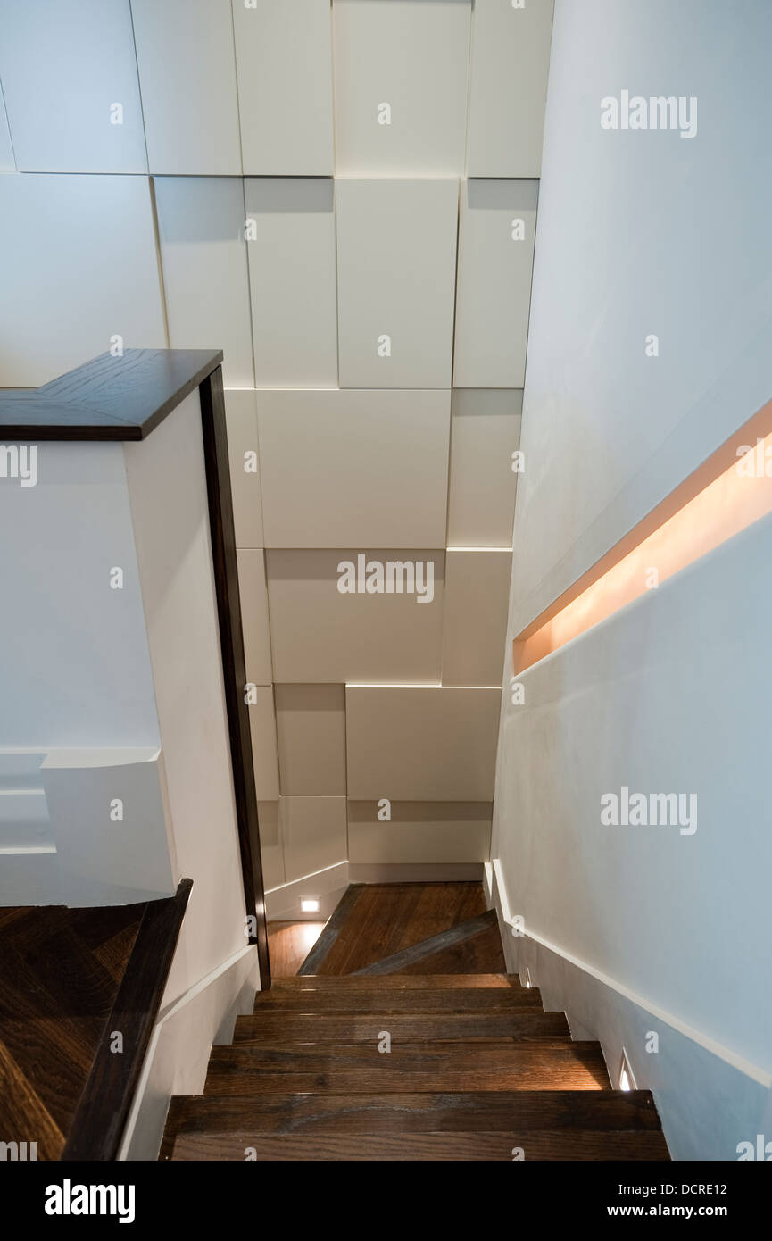 Wooden stair treads and architecturally designed wall of London city ...