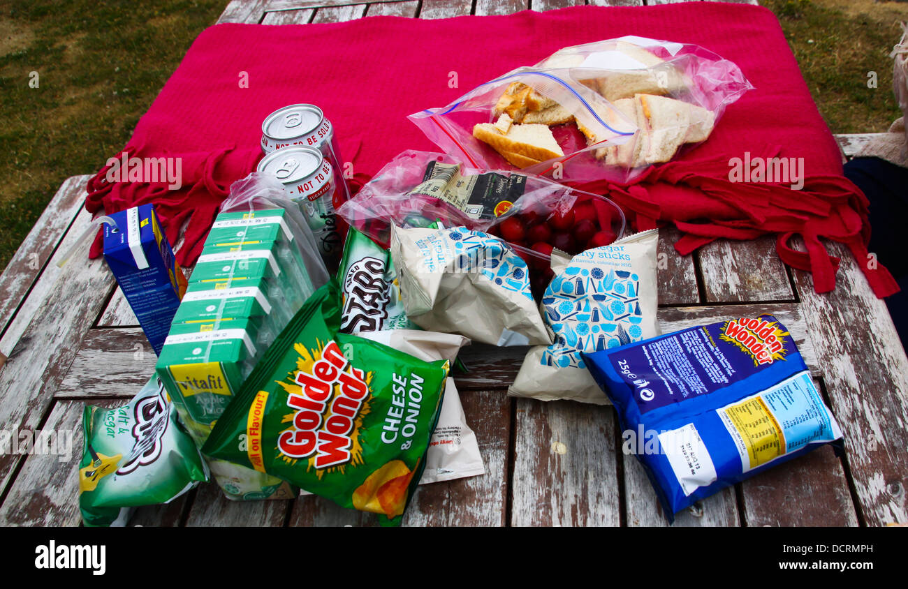 Crisps and juice on picnic table Stock Photo - Alamy