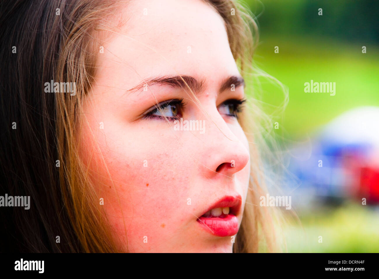Teenage girl looking off camera Stock Photo - Alamy