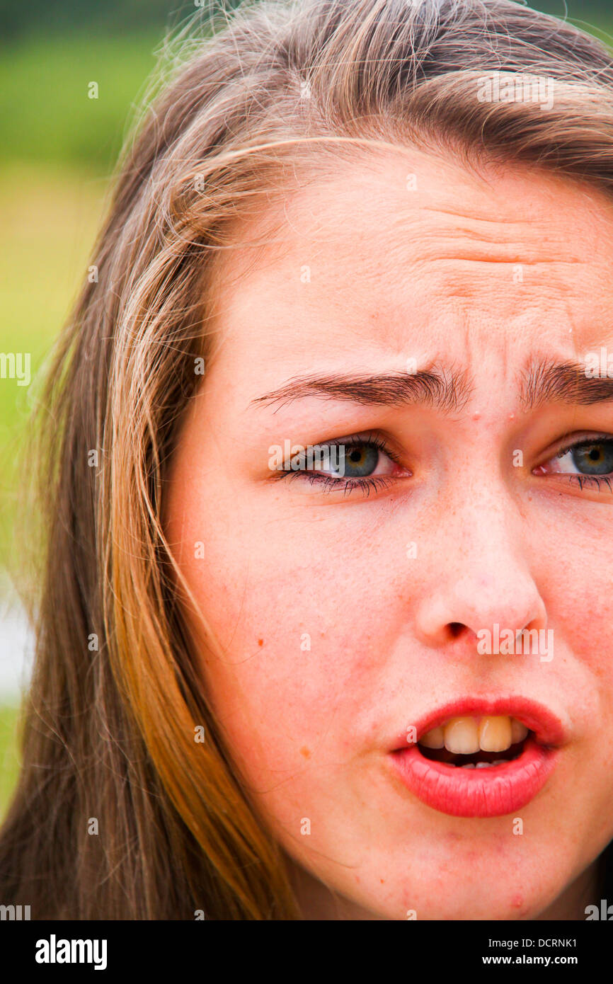 Teenage girl looking off camera speaking Stock Photo - Alamy