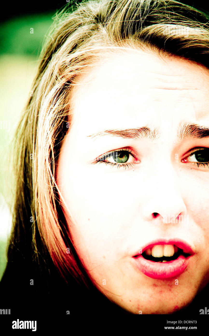 Teenage girl looking off camera speaking Stock Photo - Alamy