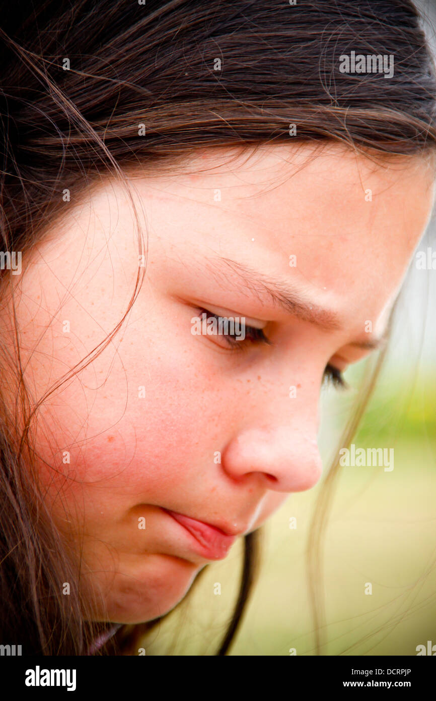 Teenage girl looking off camera Stock Photo - Alamy