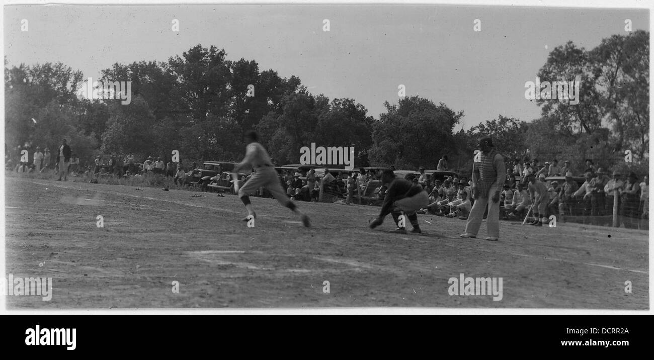 This image captures a baseball game in progress, showcasing players ...