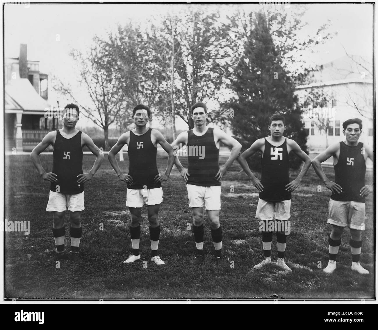 A historic photograph of a basketball team standing in uniform, dating ...